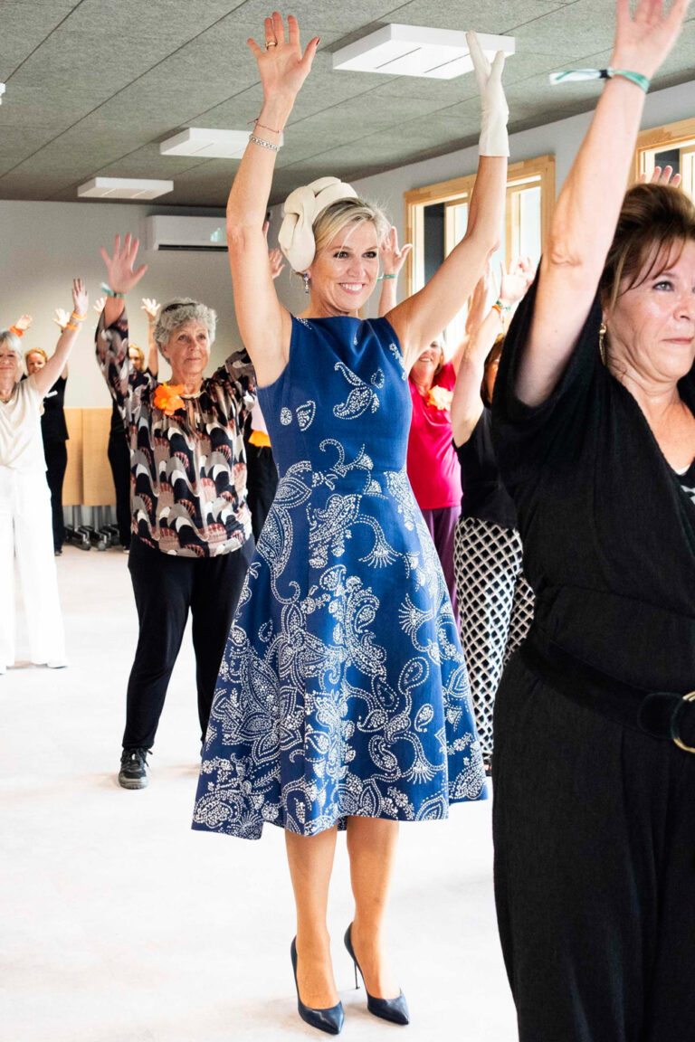 Queen Maxima Dances in Stylish Navy Blue Natan Dress