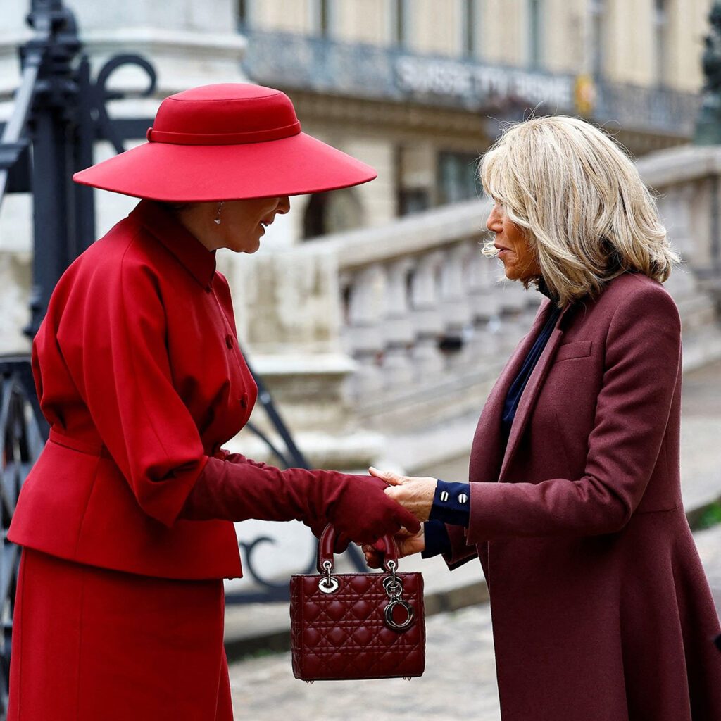 Queen Mathilde in Burgundy Dior Outfit During Paris Visit
