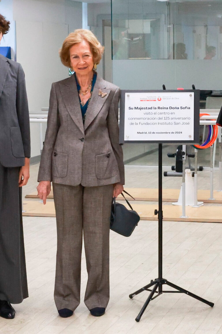 Queen Sofia with a Camera-Style Crossbody Bag by Armani