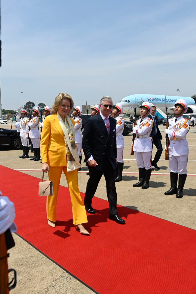 Queen Mathilde in yellow suit by Caroline Biss