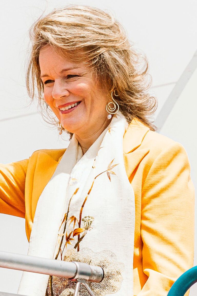 Queen Mathilde in yellow suit by Caroline Biss